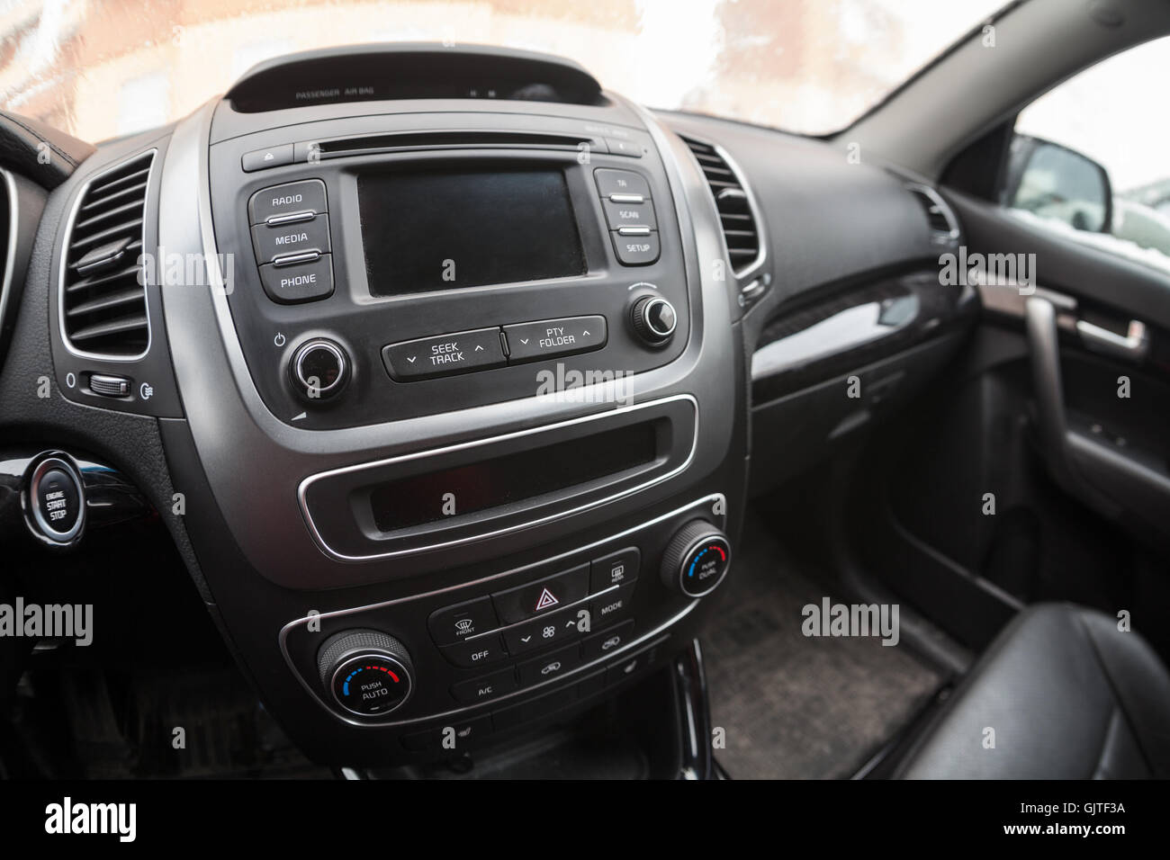 Modern car interior, dashboard with monitor and music station. Fisheye ...