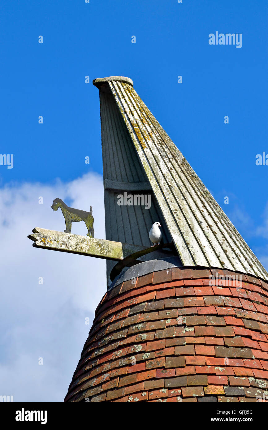 Oast house (hop kiln) in Kent. Cowl at the top, turning with the wind ...