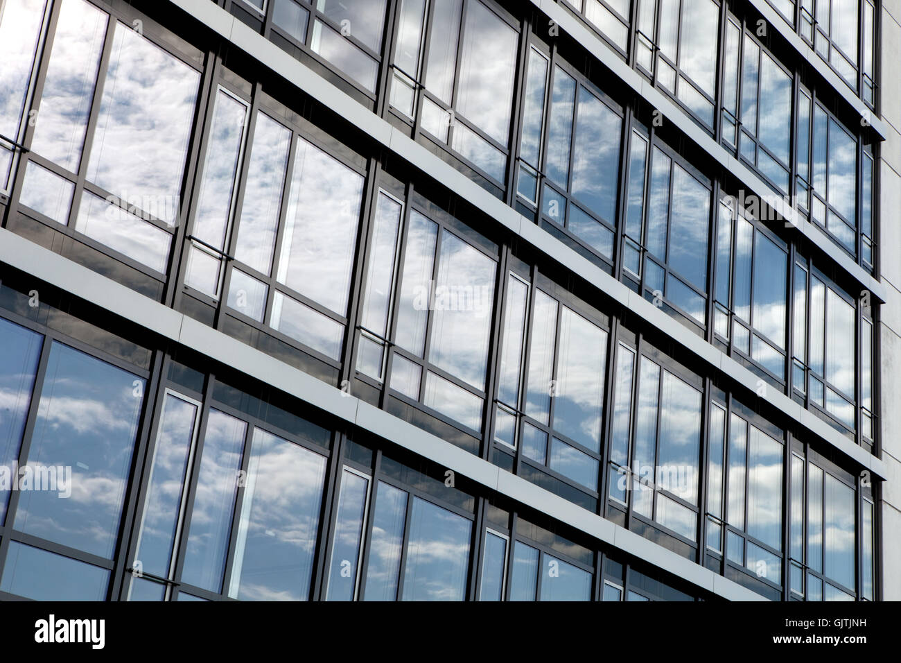 mirrored facade of an office building Stock Photo - Alamy