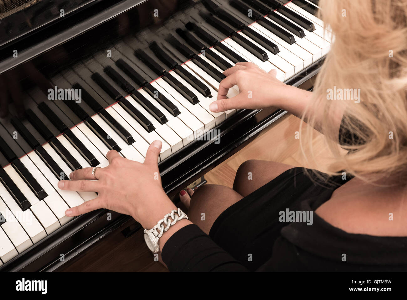 Hands of an elegant classical musician woman playing on piano Stock ...