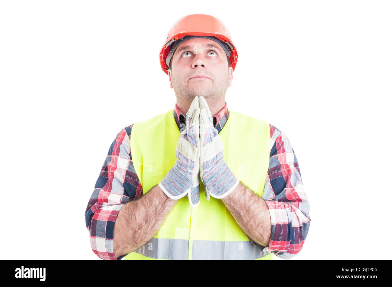 Construction engineer holding hands closed and praying as belief and ...