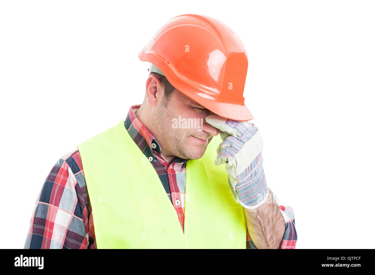 Portrait of stressed male builder looking upset and having problems ...
