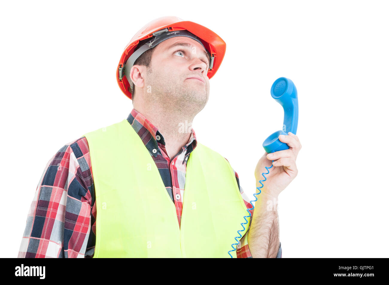 Bored engineer holding retro receiver and looking up isolated on white ...