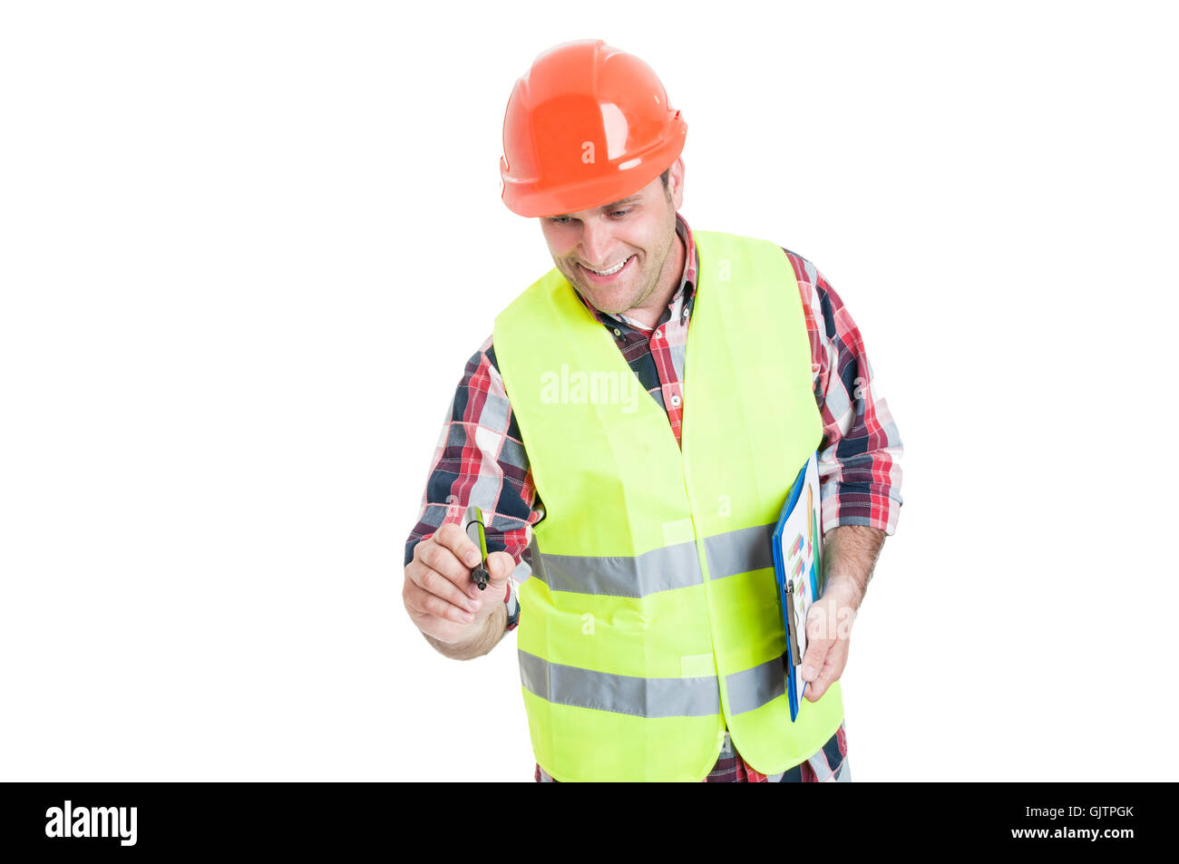 Successful builder writing with marker on transparent board and smiling ...
