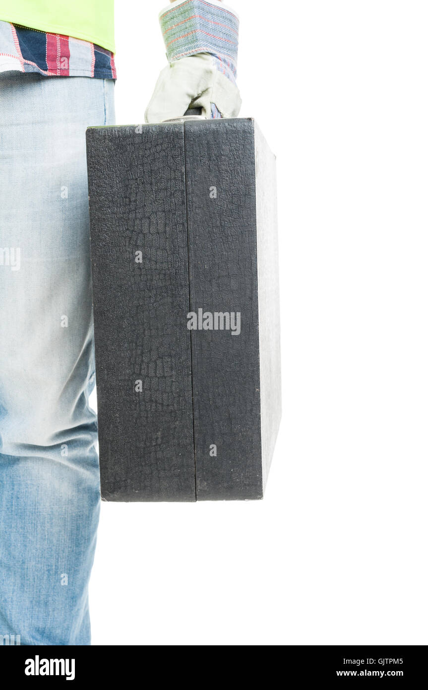 Close-up of builder carrying heavy toolbox on his work isolated on ...