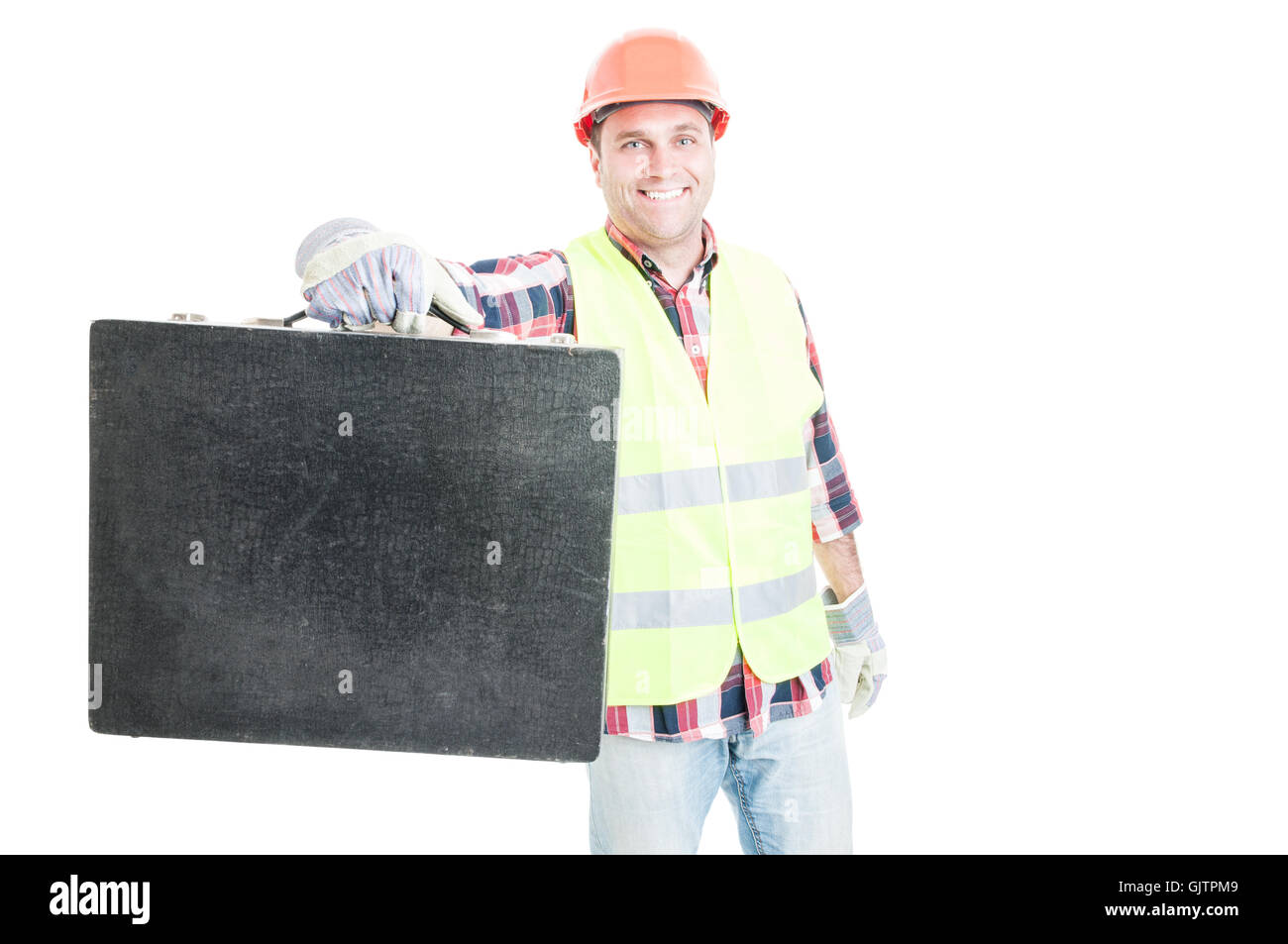 Joyful young constructor showing his toolbox with copy space area ...