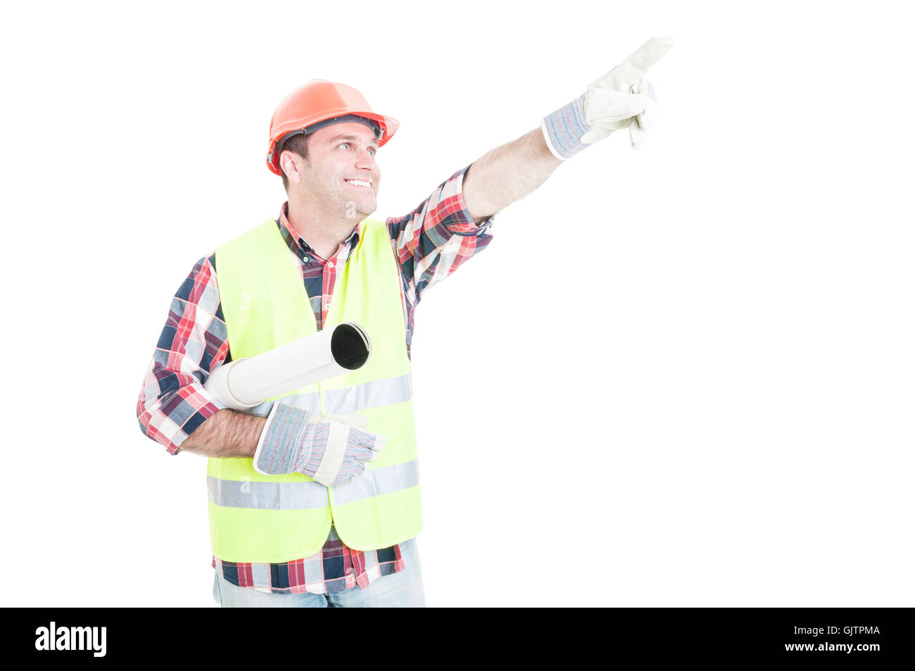 Happy architect with rolled building plan pointing finger at something ...