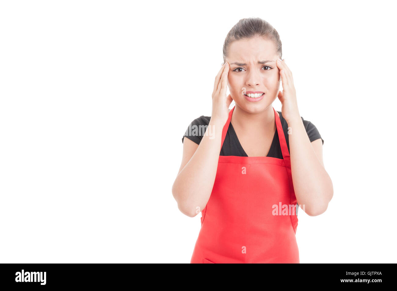 Hypermarket employee with red apron looking stressed and worried ...