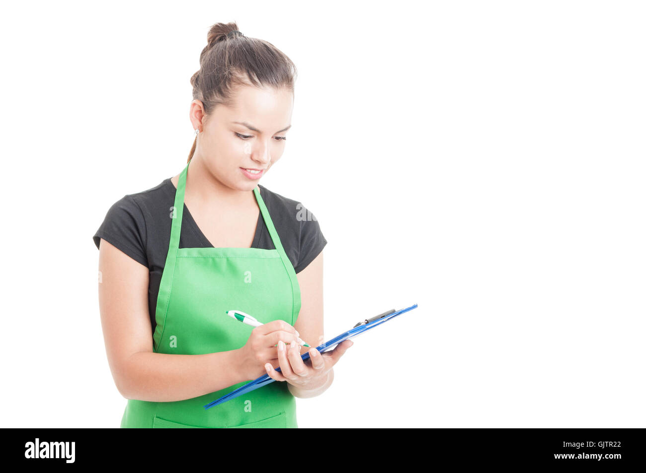 Attractive female seller at work holding clipboard and counting ...