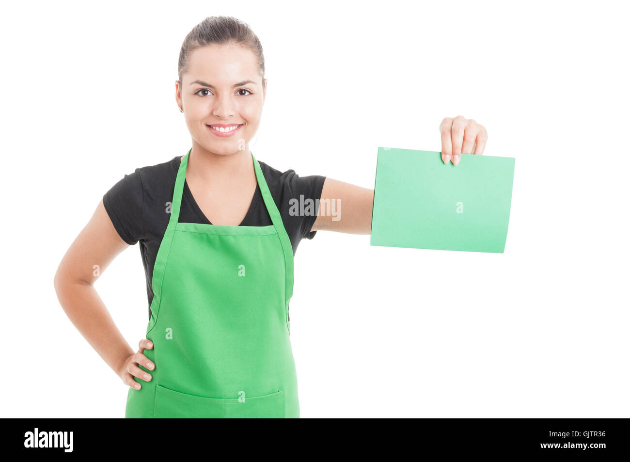 Attractive young seller with empty sheet of paper in her hand with ...