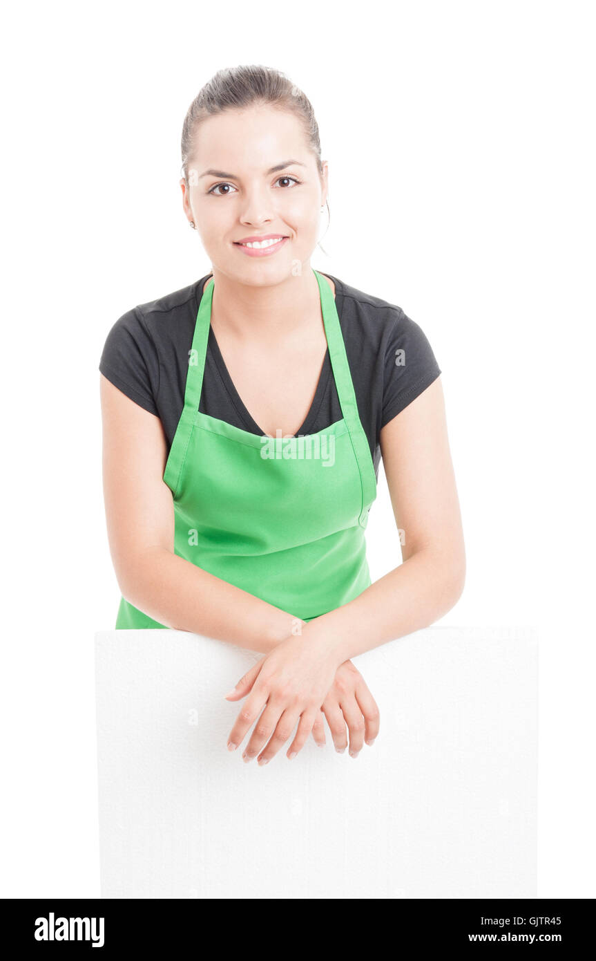 Happy supermarket seller standing behind big blank poster isolated on ...