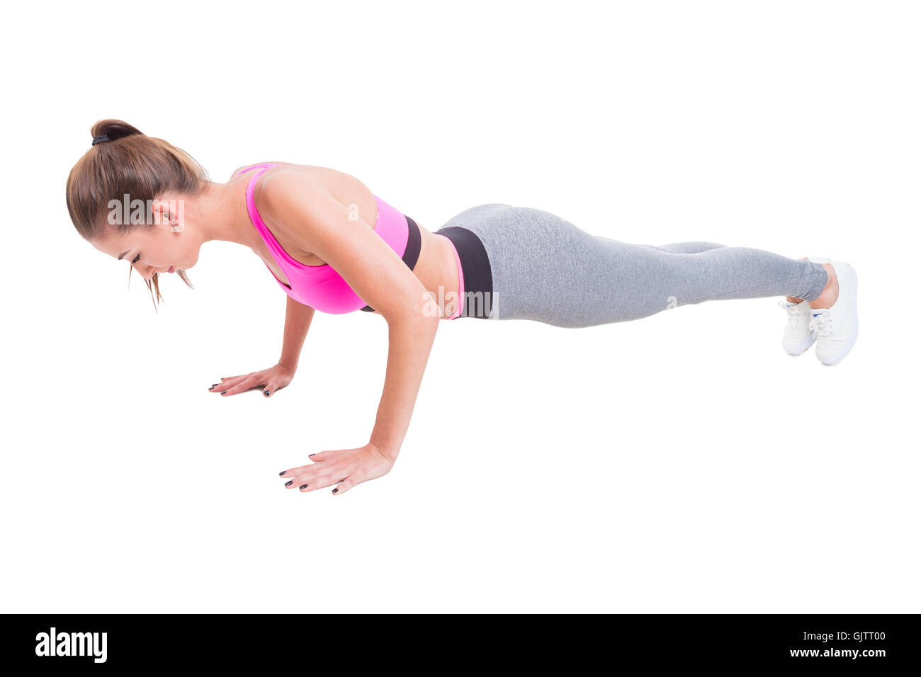 Full body of fit girl doing push-up for working out isolated on white ...