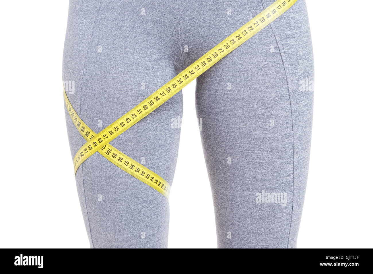 Close-up of fit legs with measured by tape line isolated on white ...