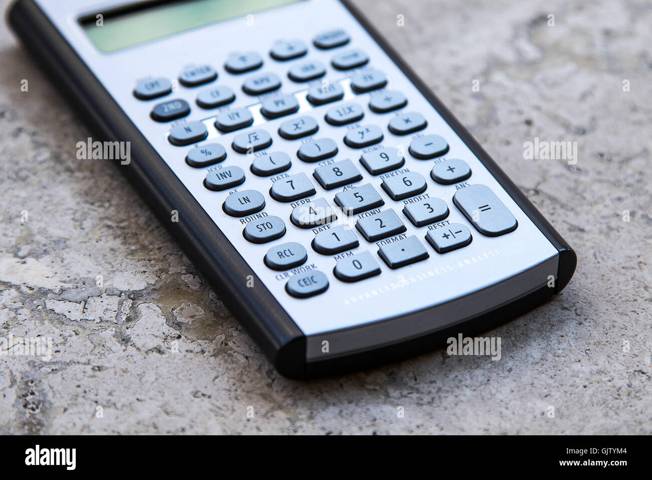 An old finance calculator on a table Stock Photo - Alamy