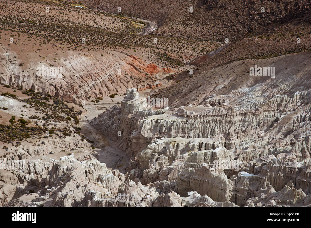 Eroded rock formations at the head of a river valley feeding the River ...