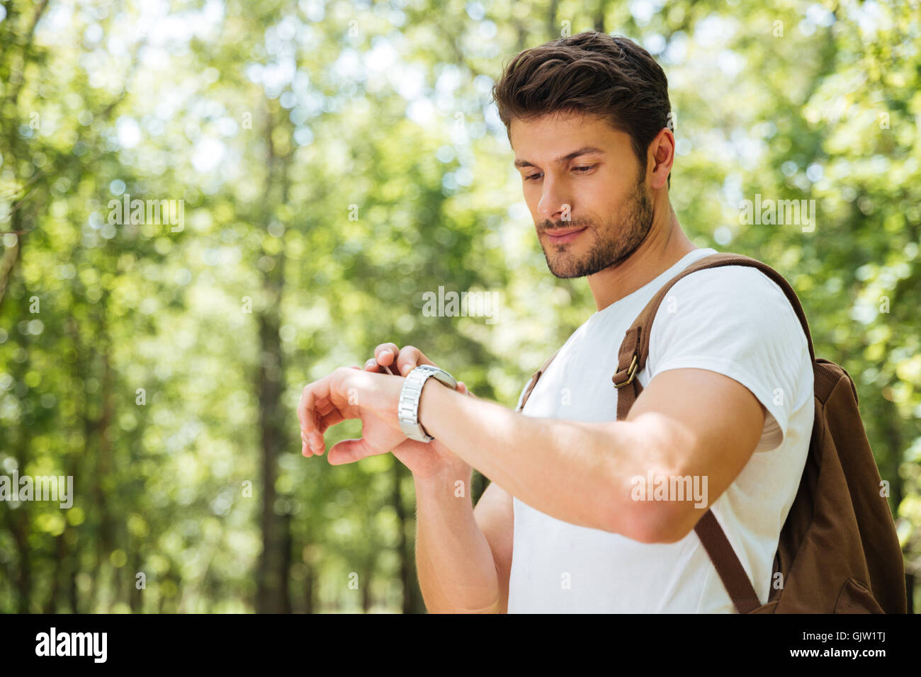 Man looking at watch outside hi-res stock photography and images - Alamy