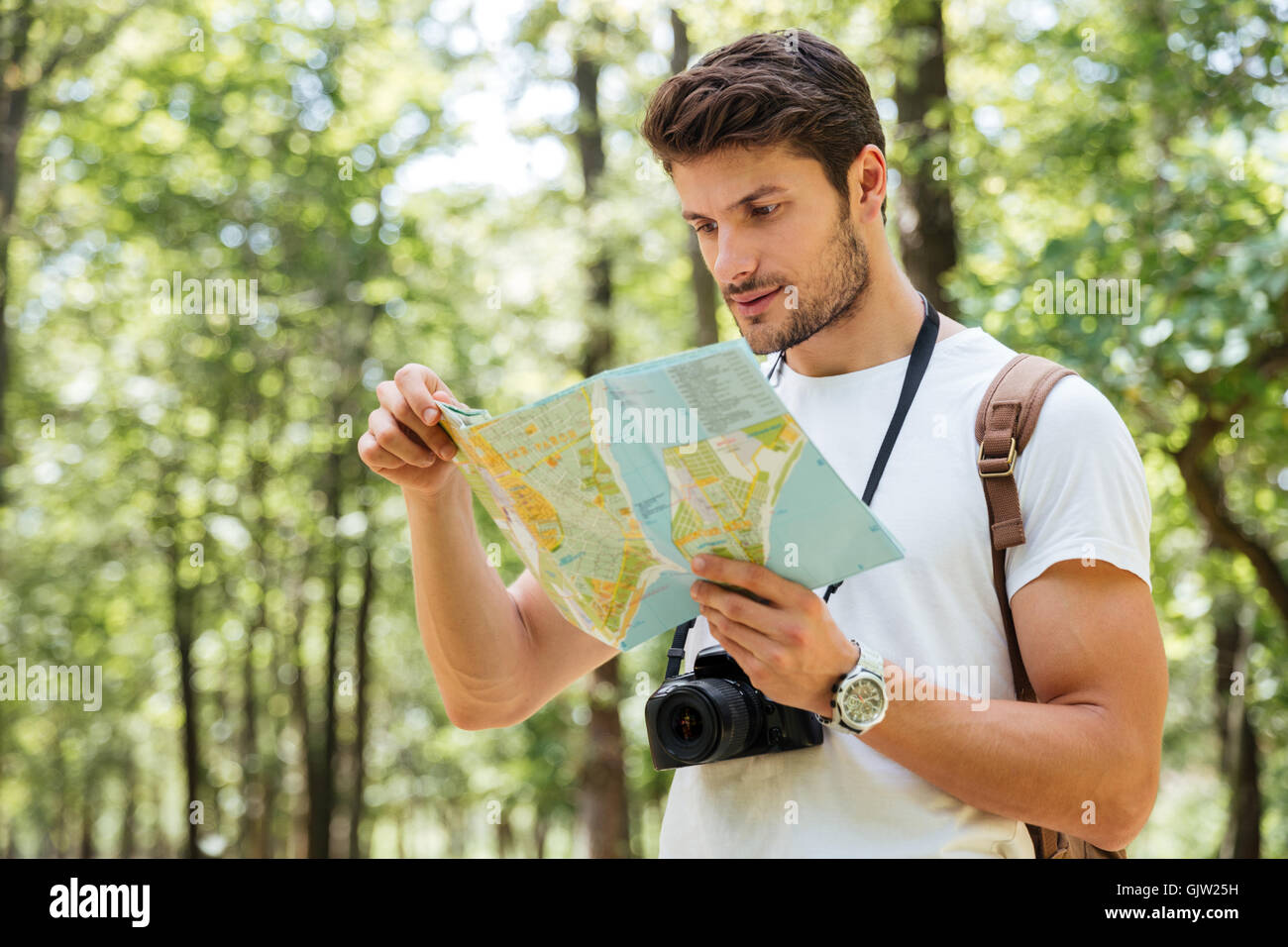 Male hiker sitting map in hi-res stock photography and images - Alamy
