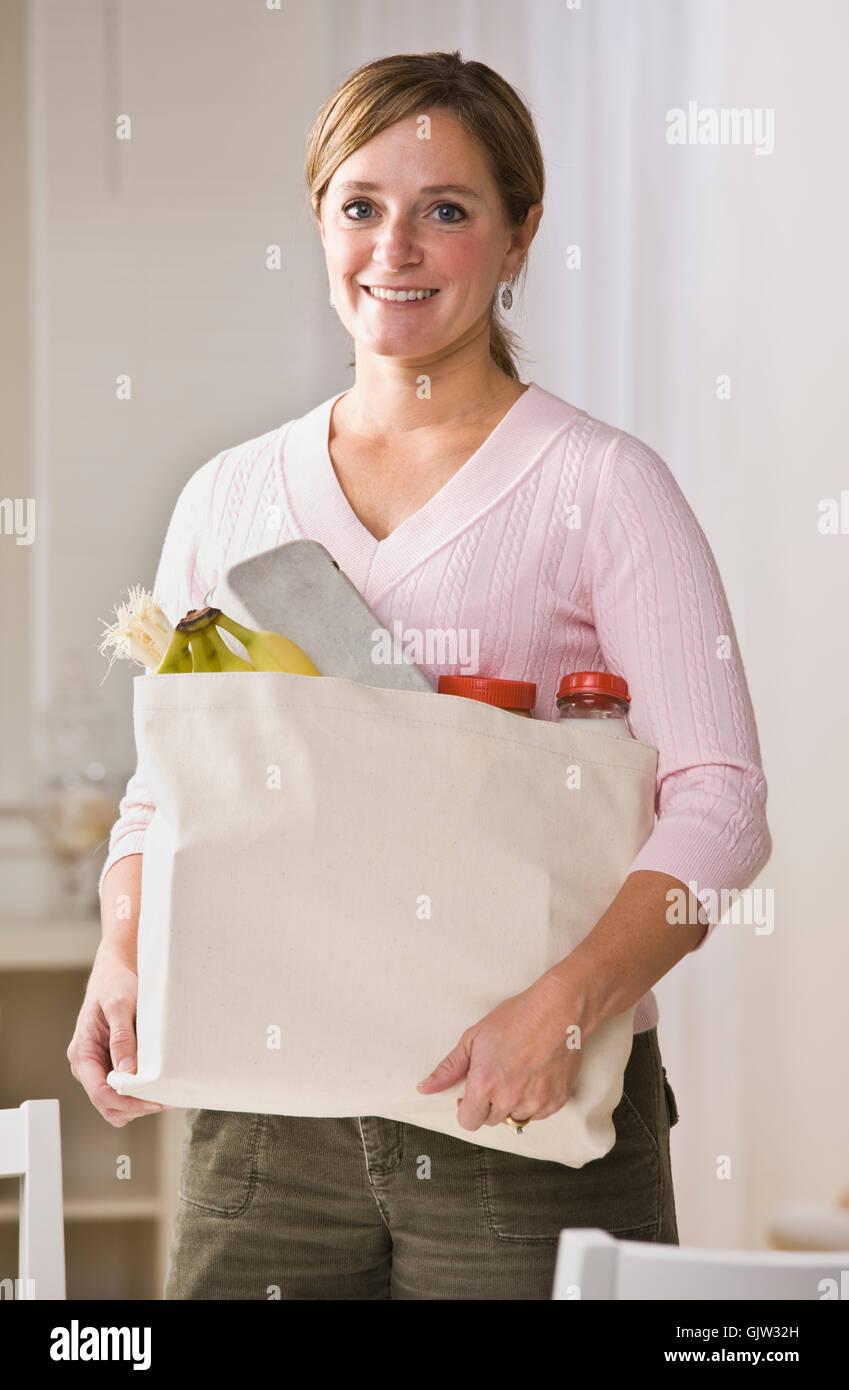 woman house building Stock Photo - Alamy