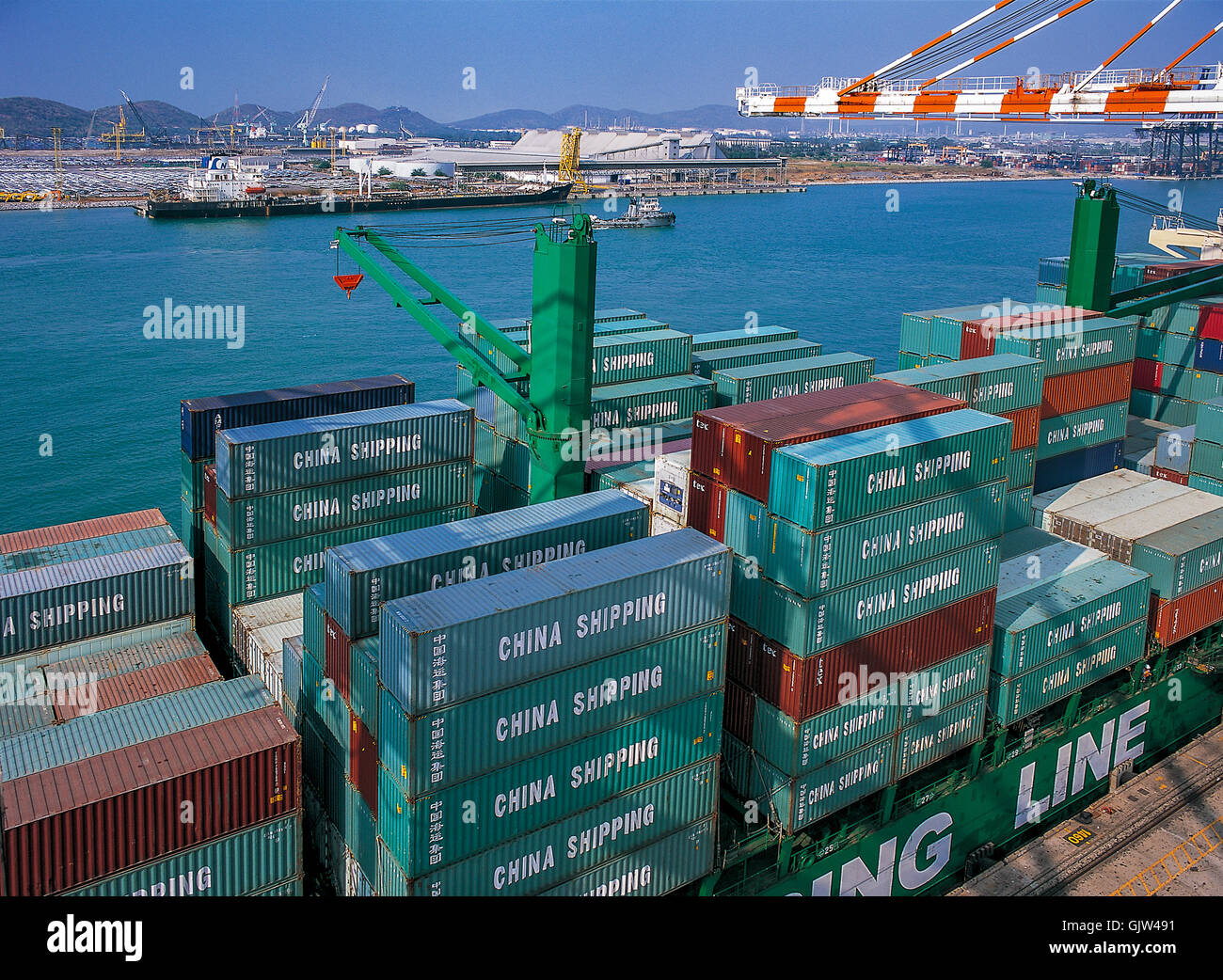 Cargo ships loading containers and moving from the harbor Stock Photo ...