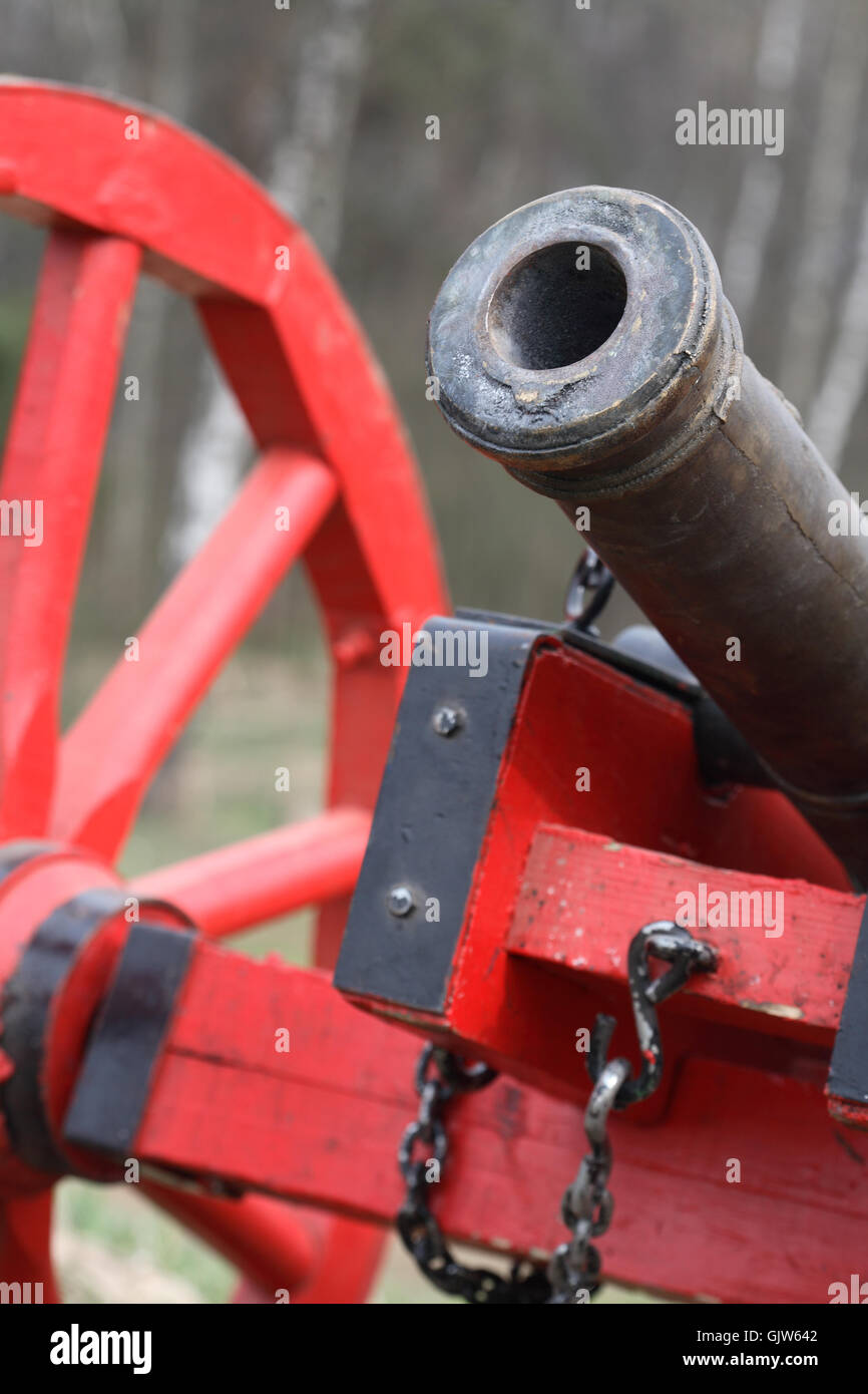 Closeup of vintage red cannon outdoor on forest background Stock Photo ...