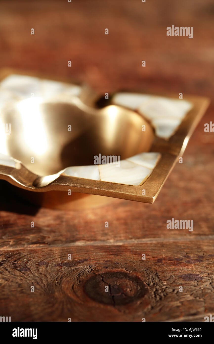 Nice vintage empty ashtray on wooden background Stock Photo - Alamy