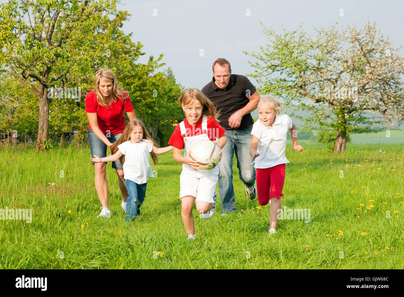 family plays ball Stock Photo - Alamy