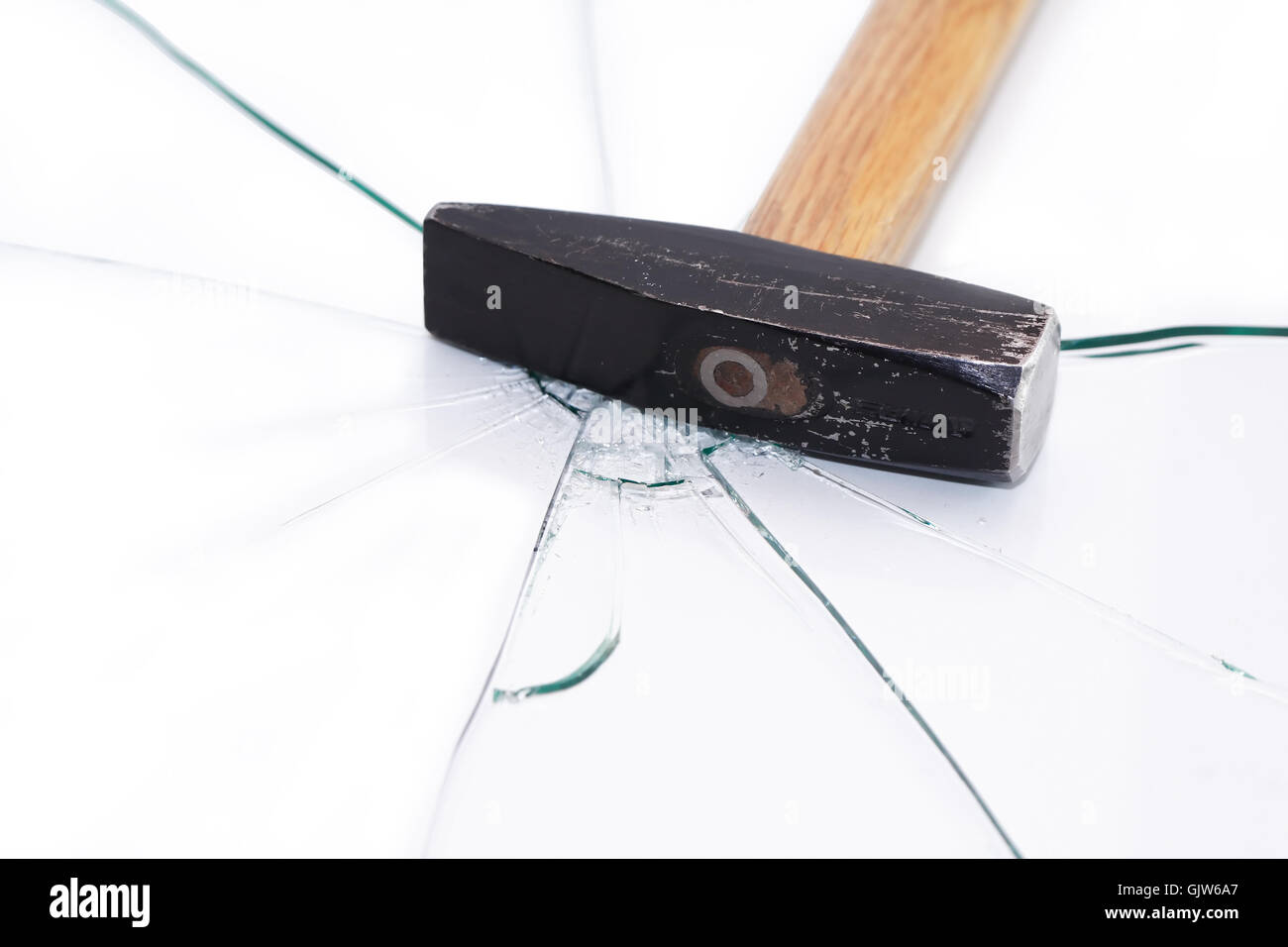 Destruction concept. Hammer on shattered glass with splinters Stock ...