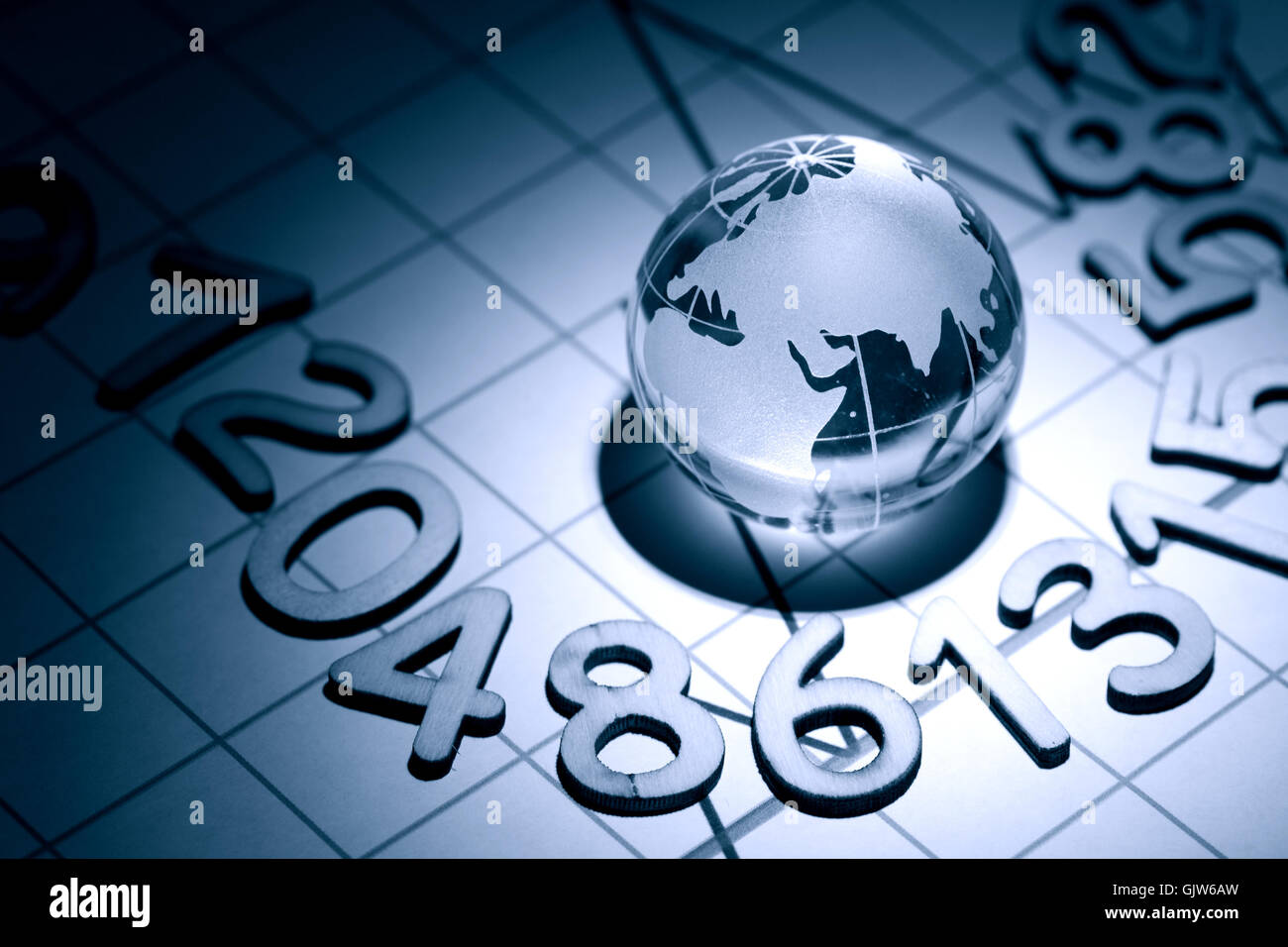 Business concept. Glass globe on background with diagram and numbers ...