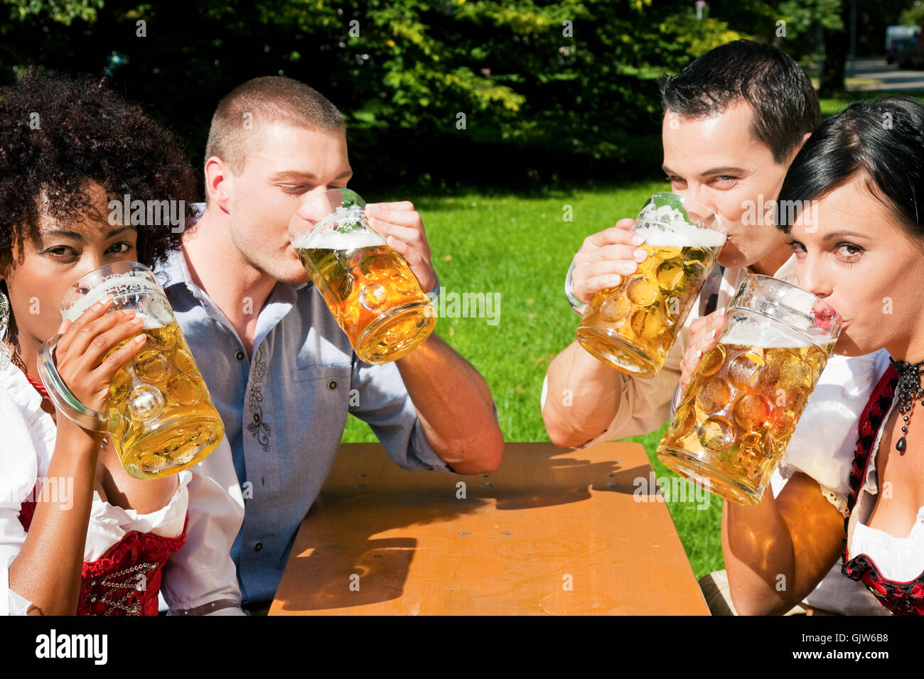 group of friends in the beer garden Stock Photo - Alamy