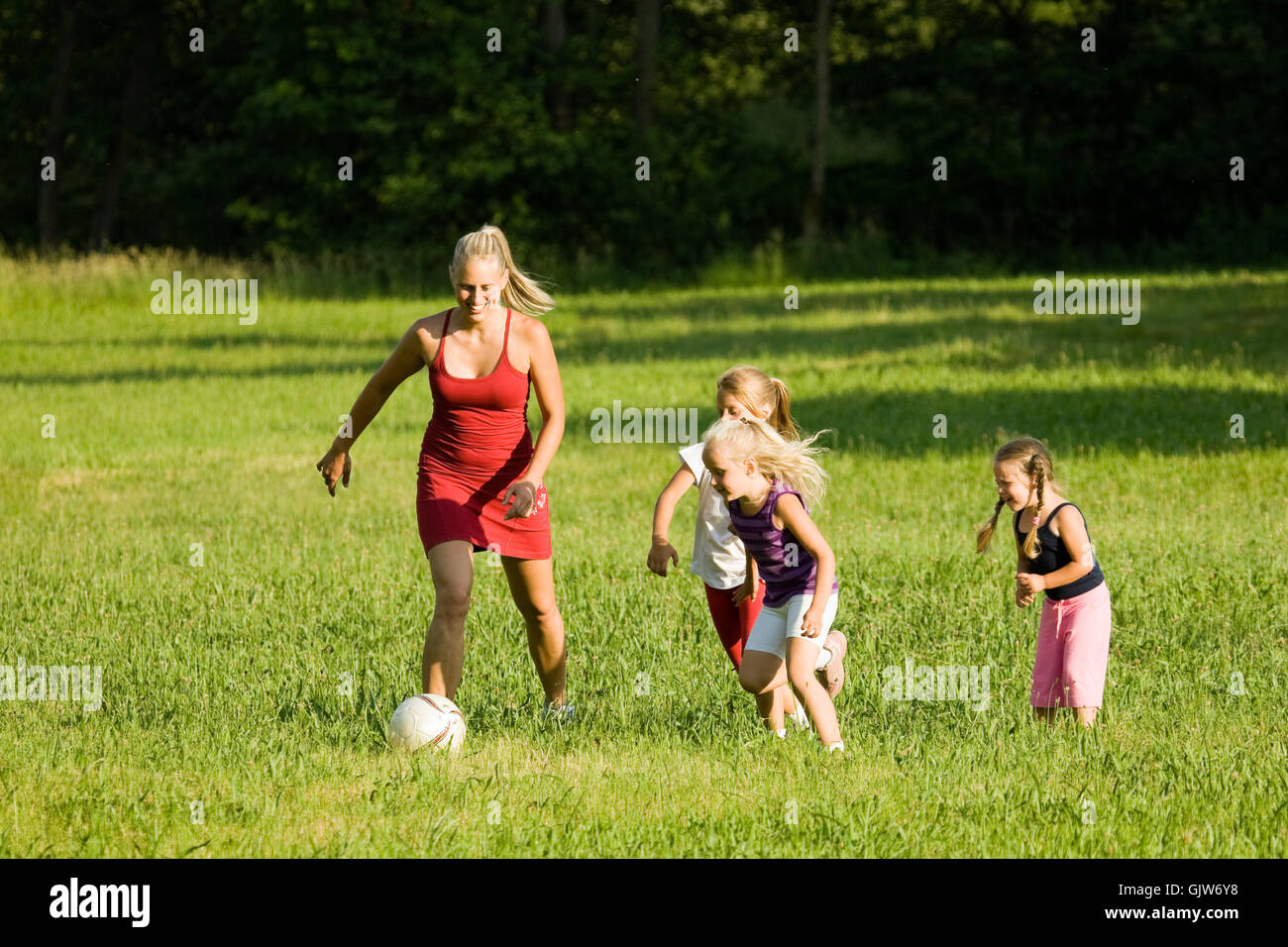 family playing soccer Stock Photo - Alamy