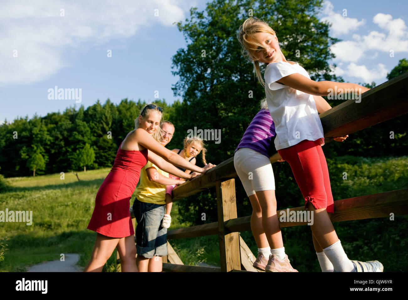 family on the bridge Stock Photo - Alamy