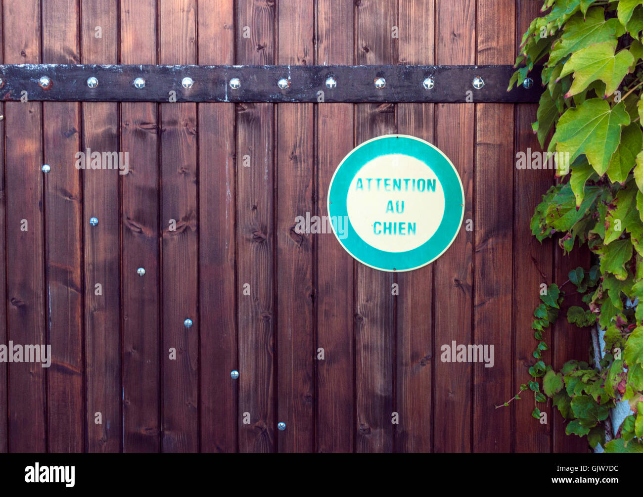 wooden gate with dog warning sign Stock Photo - Alamy
