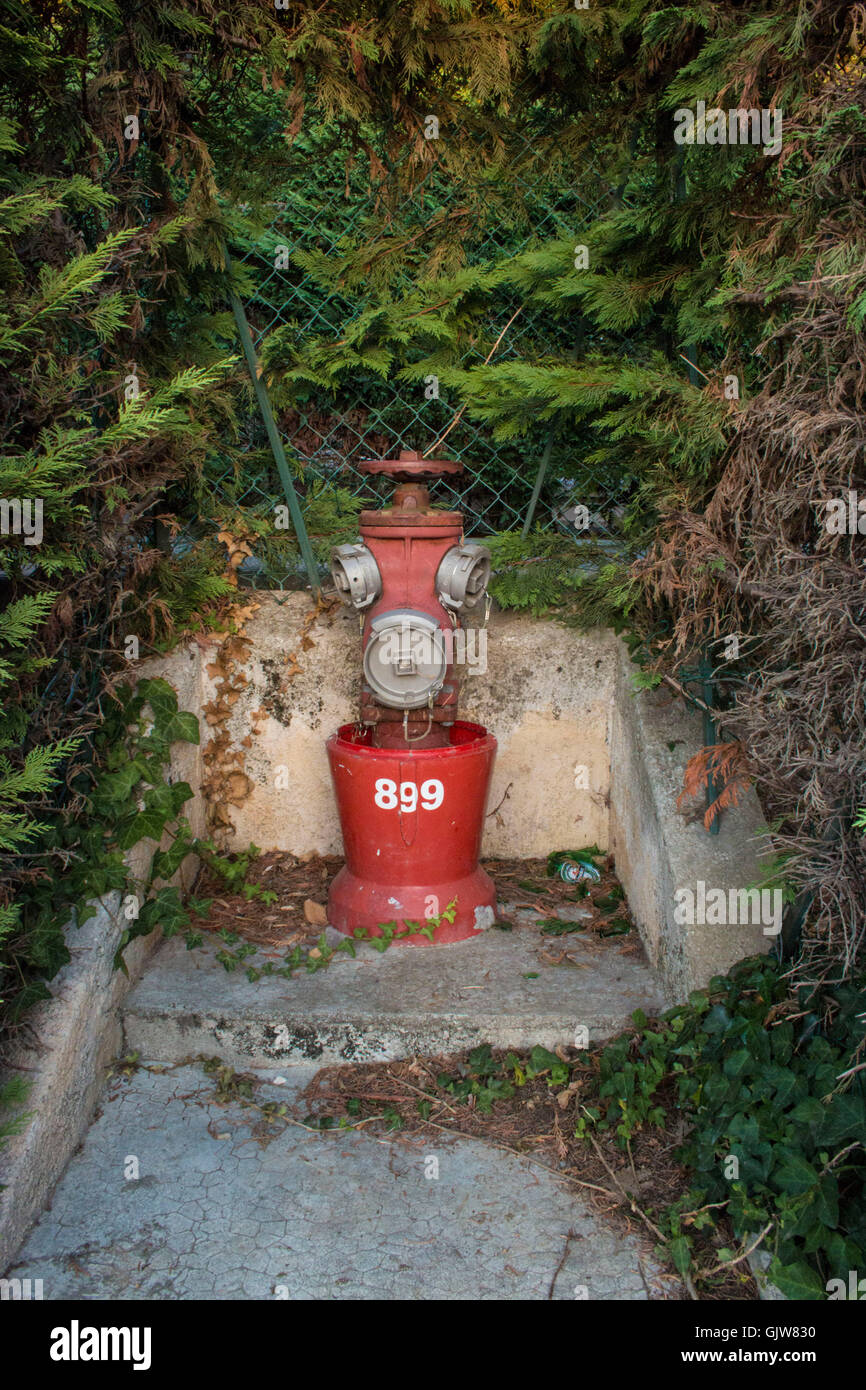 red painted French fire hydrant france Stock Photo - Alamy