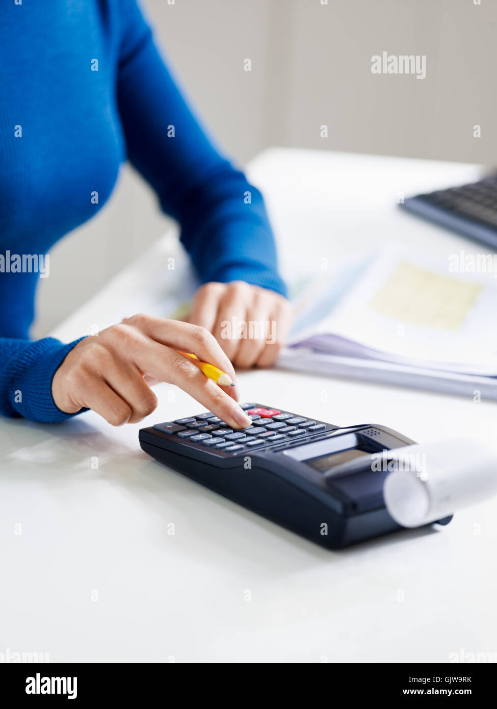 Woman budgeting, calculator hi-res stock photography and images - Alamy