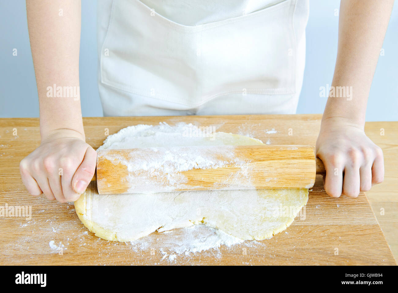 Hands flattening cake dough hi-res stock photography and images - Alamy