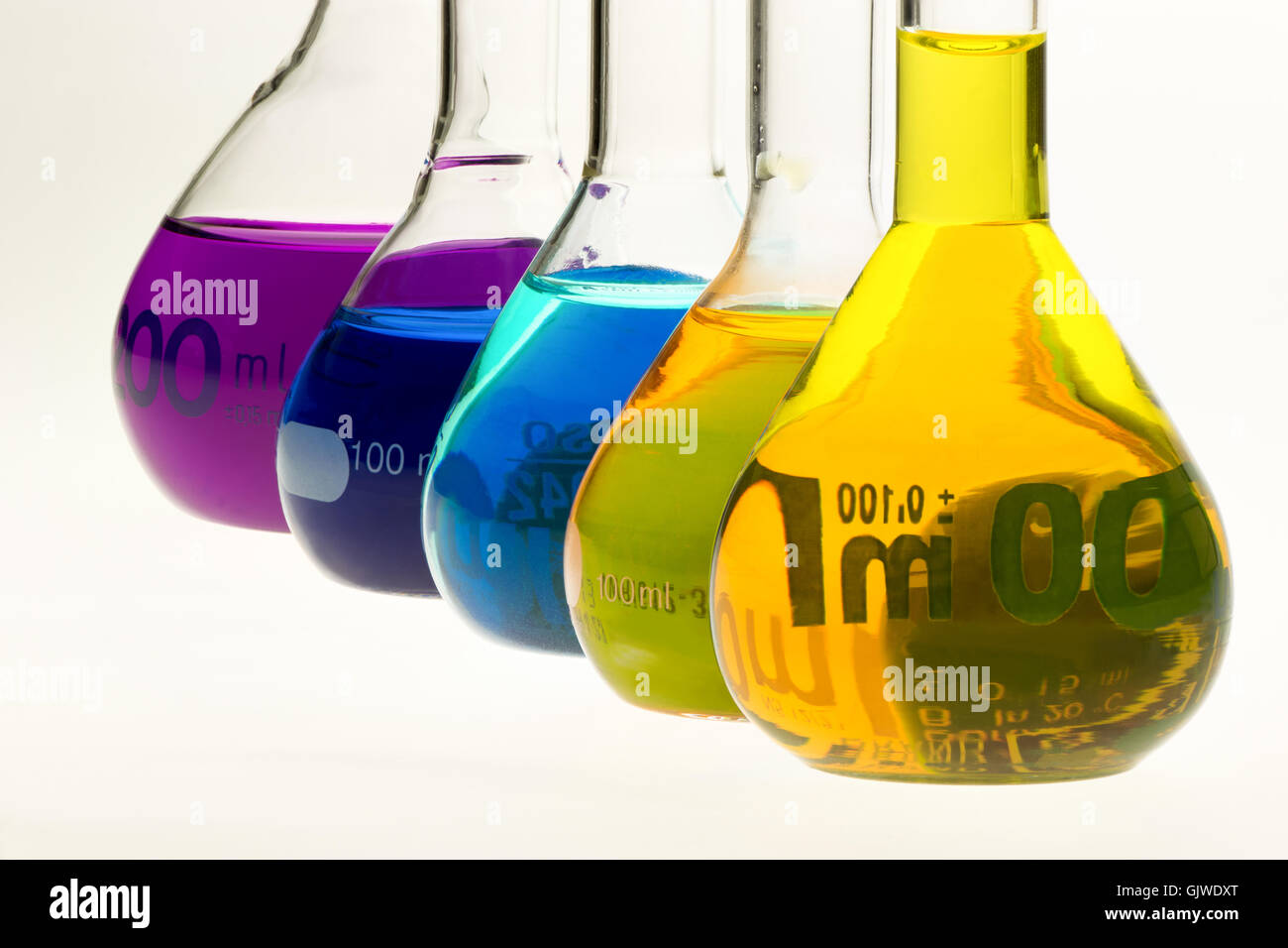 chemical flasks with colored solutions in a row Stock Photo - Alamy