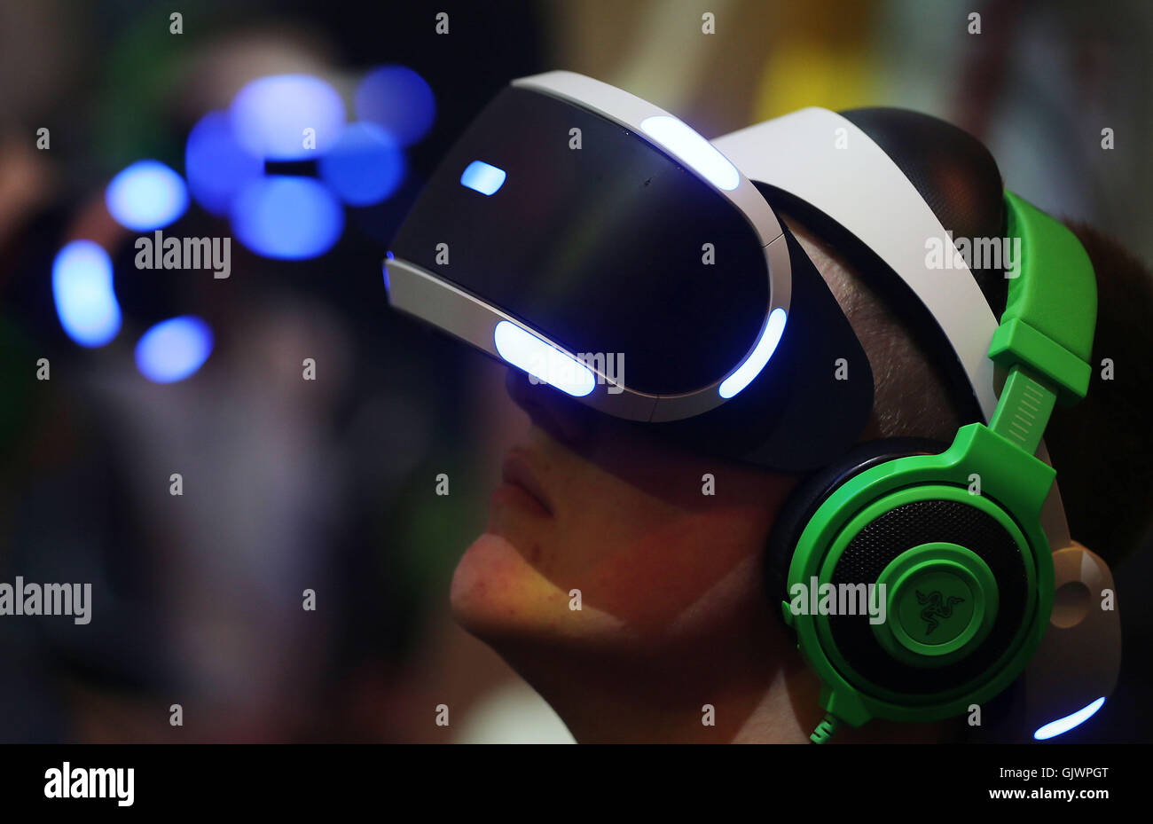 Cologne, Germany. 18th Aug, 2016. Visitors try out the computer game ...