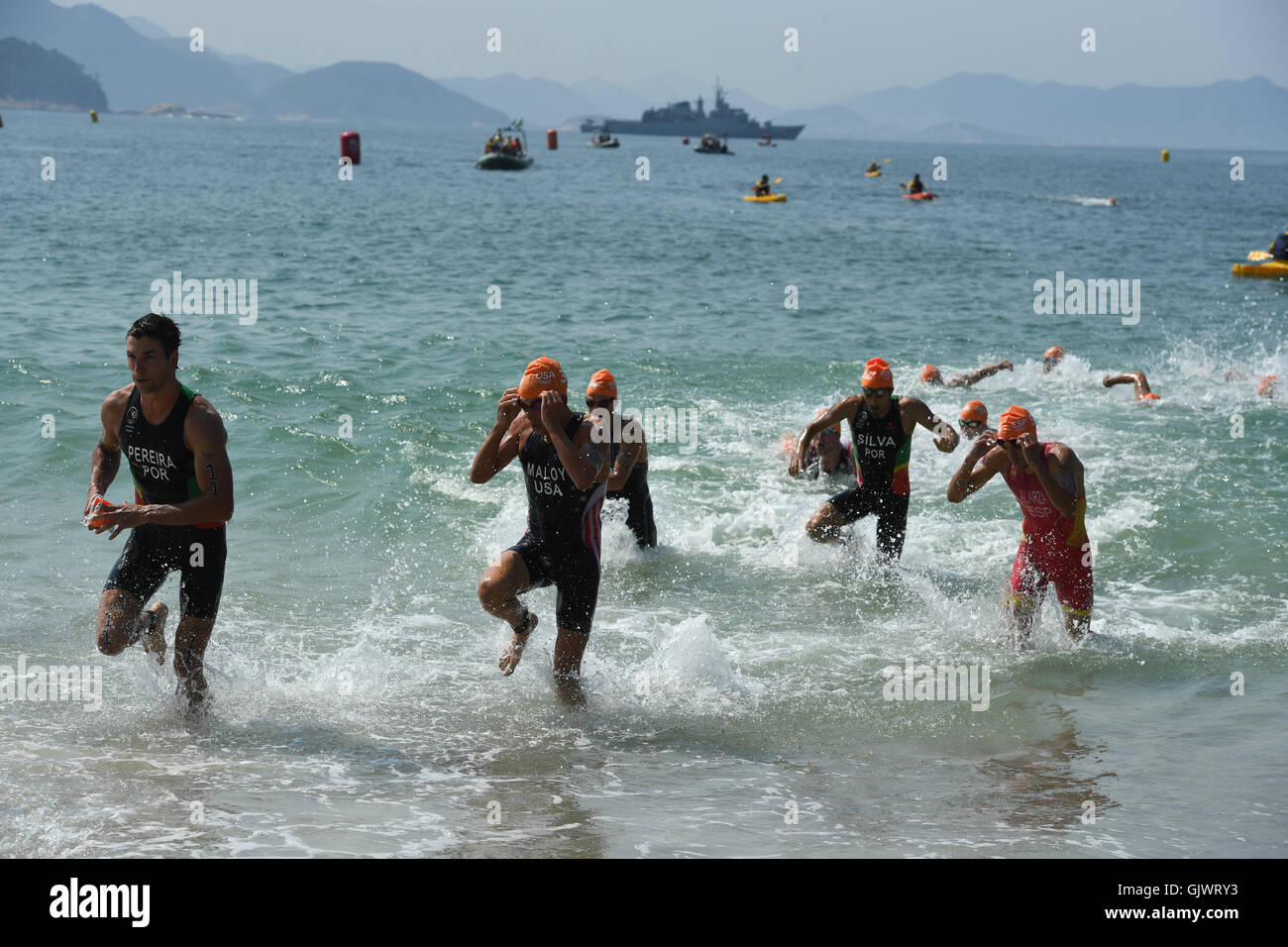 Rio de Janeiro, Brazil. 18th Aug, 2016. Participants run out of the ...