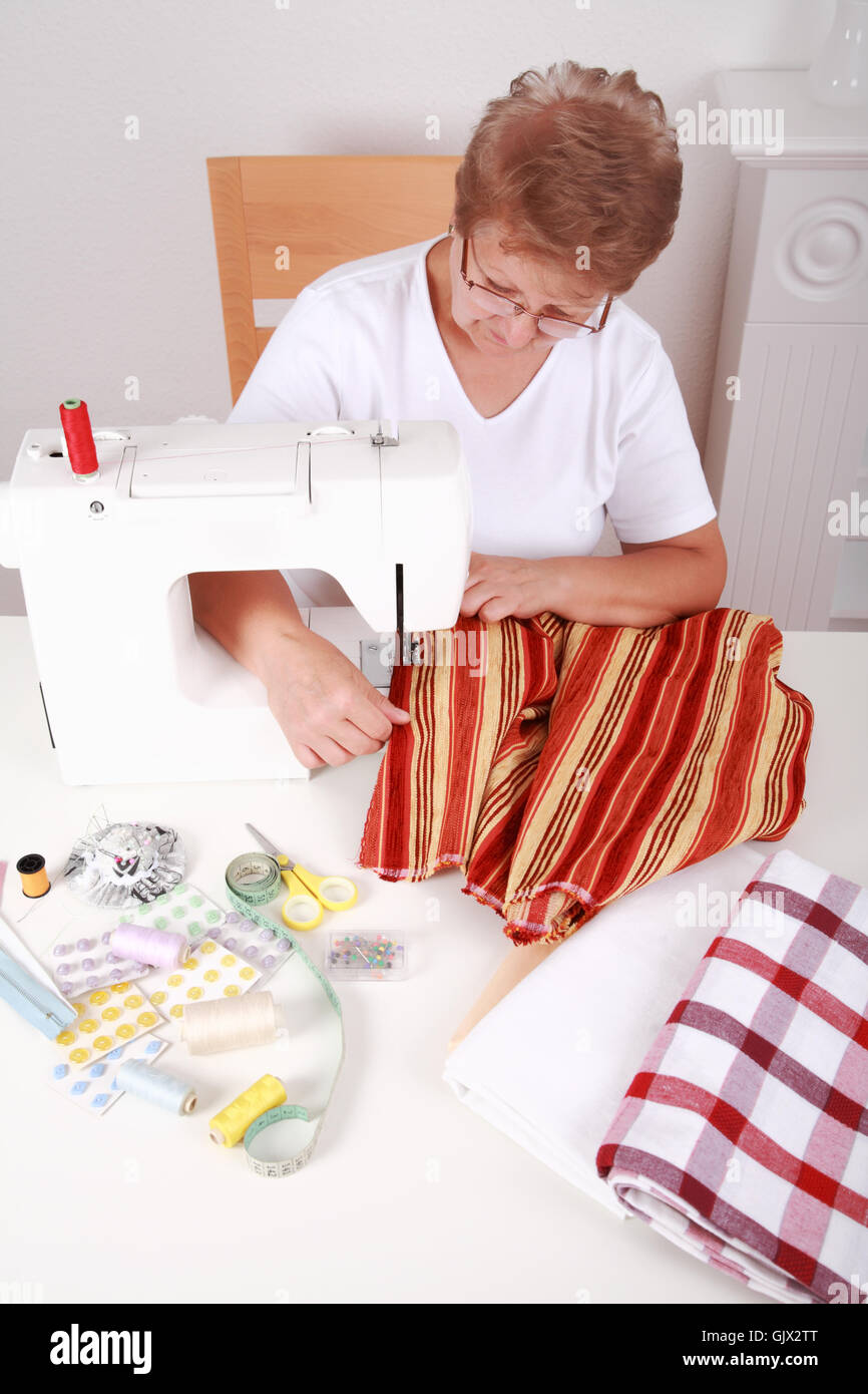 woman sew sewing Stock Photo - Alamy