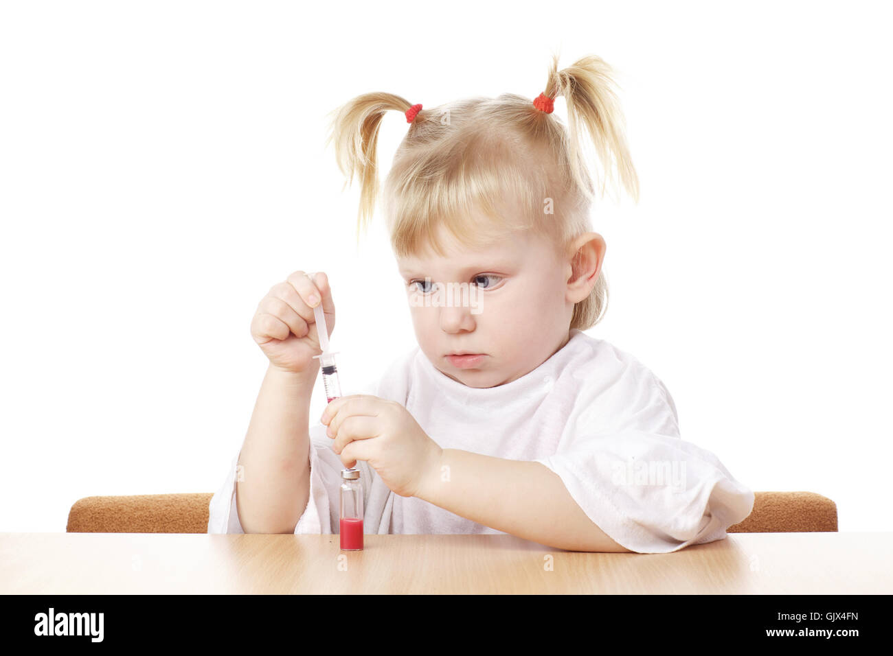 child playing with a syringe Stock Photo - Alamy