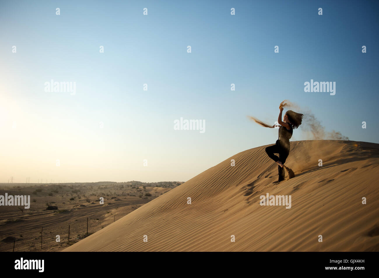 Woman in the desert Stock Photo - Alamy