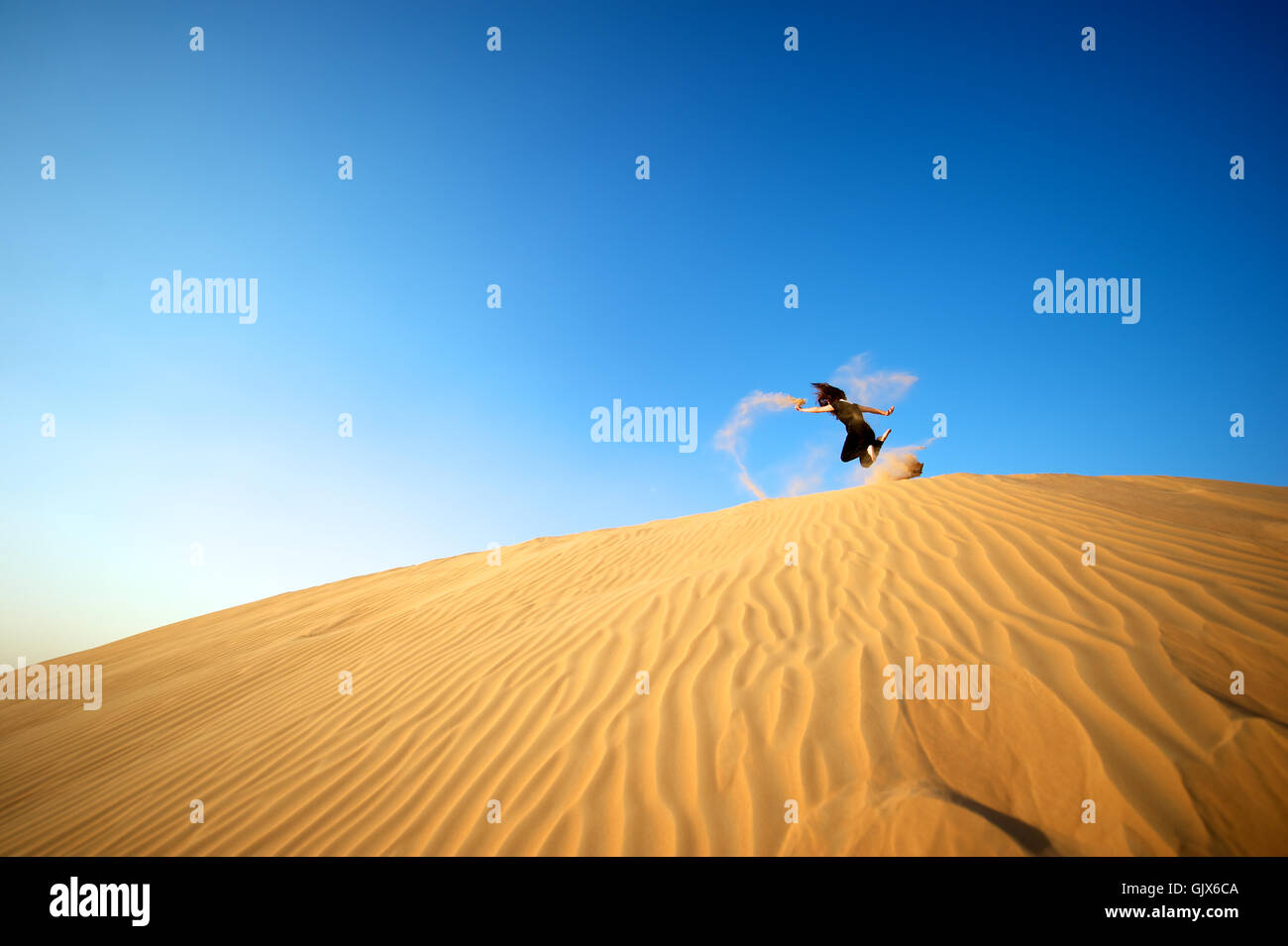 Woman in the desert Stock Photo - Alamy