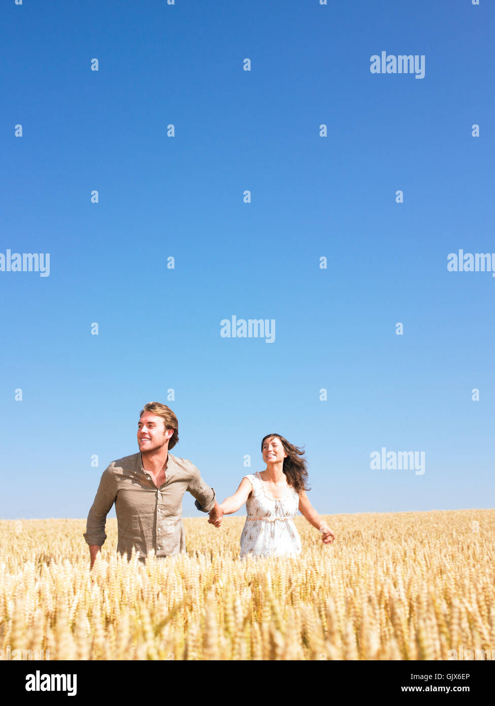 Pretty woman walk in wheat hi-res stock photography and images - Alamy