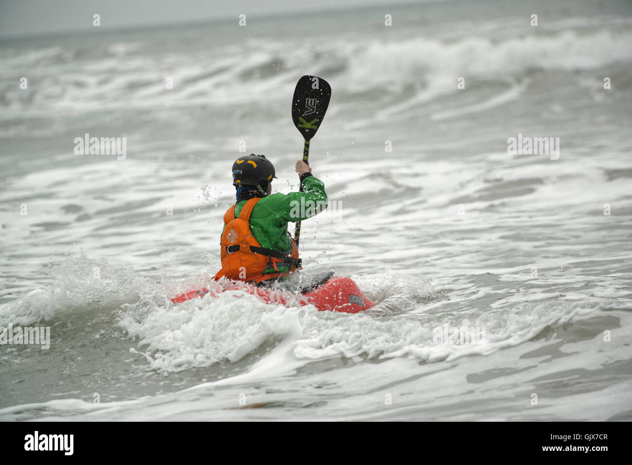 Kayaking on the beach in the surf at Porth Neigwl Stock Photo - Alamy