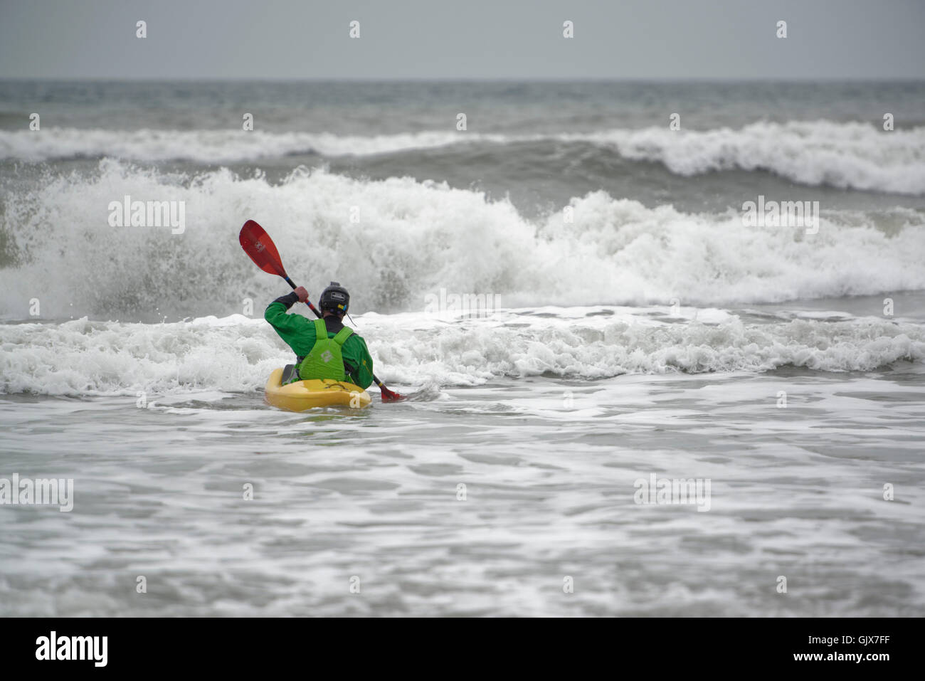 Kayaking on the beach in the surf at Porth Neigwl Stock Photo - Alamy