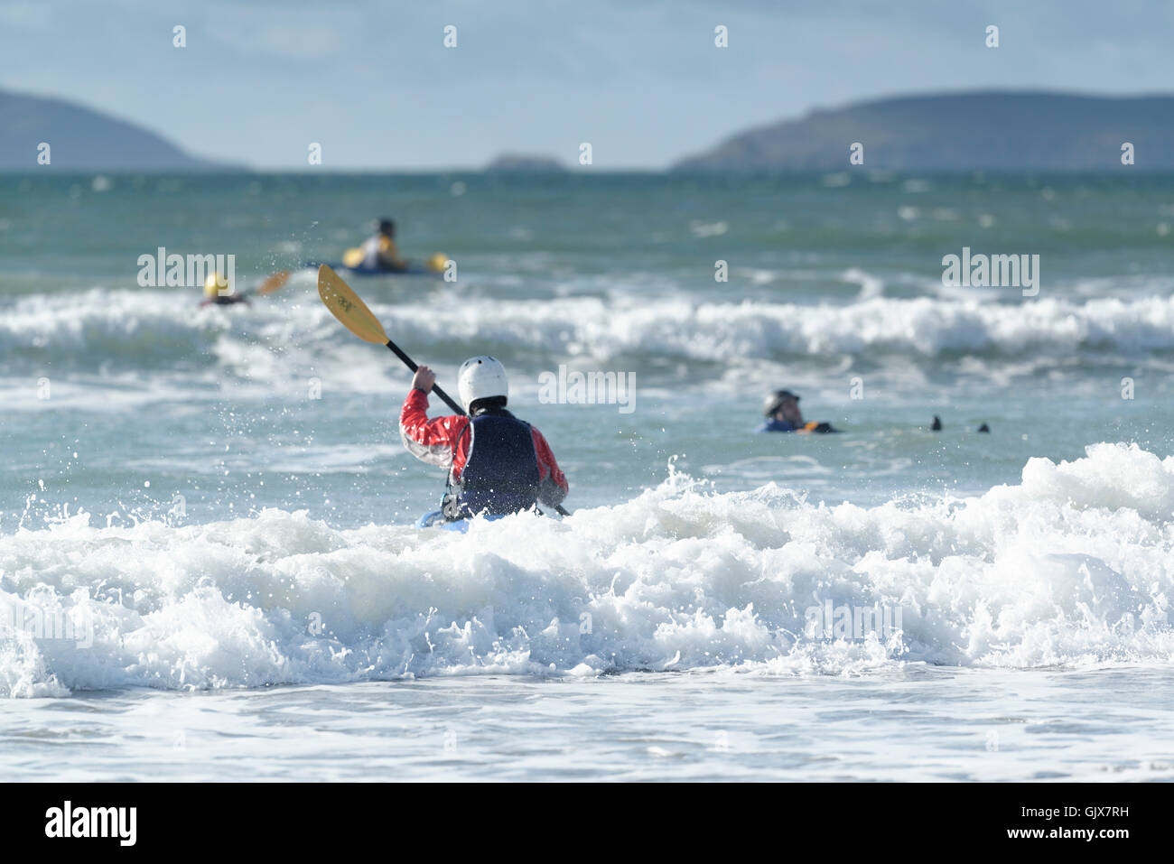 Kayaking on the beach in the surf at Porth Neigwl Stock Photo - Alamy