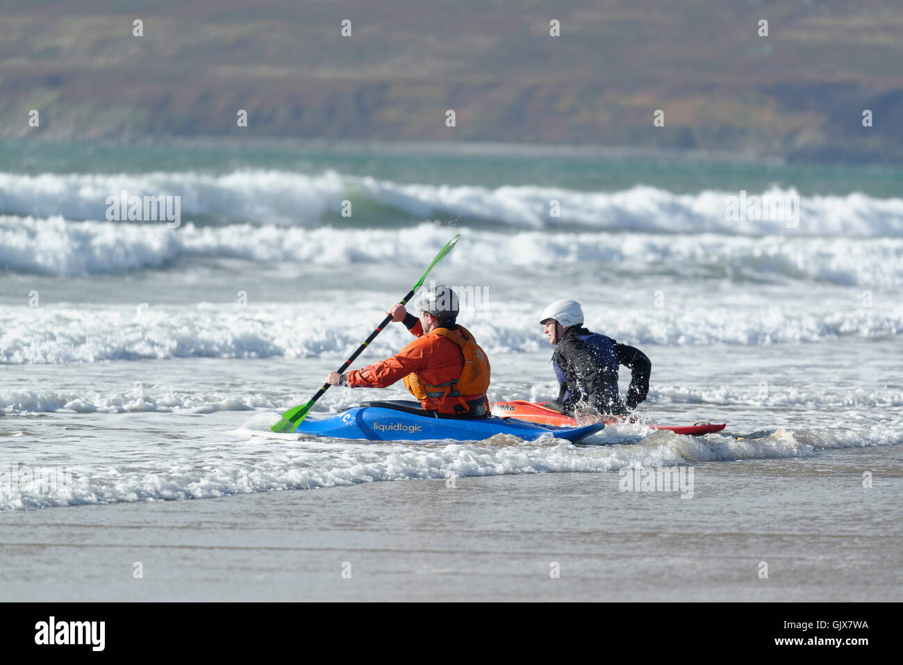 Kayaking on the beach in the surf at Porth Neigwl Stock Photo - Alamy