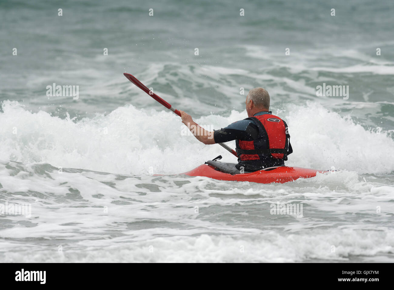 Kayaking on the beach in the surf at Porth Neigwl Stock Photo - Alamy