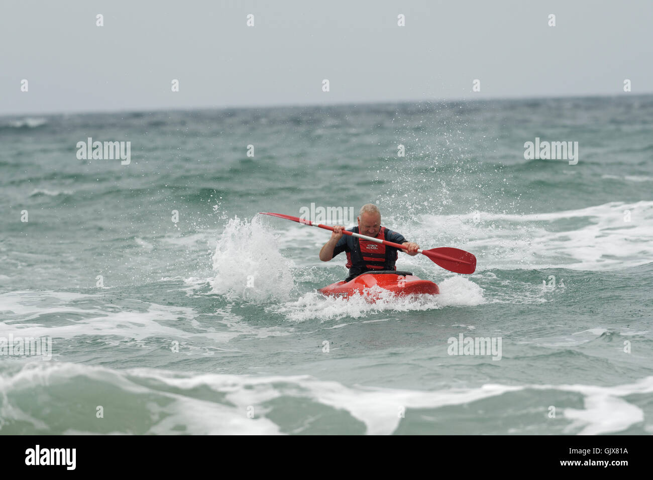 Kayaking on the beach in the surf at Porth Neigwl Stock Photo - Alamy