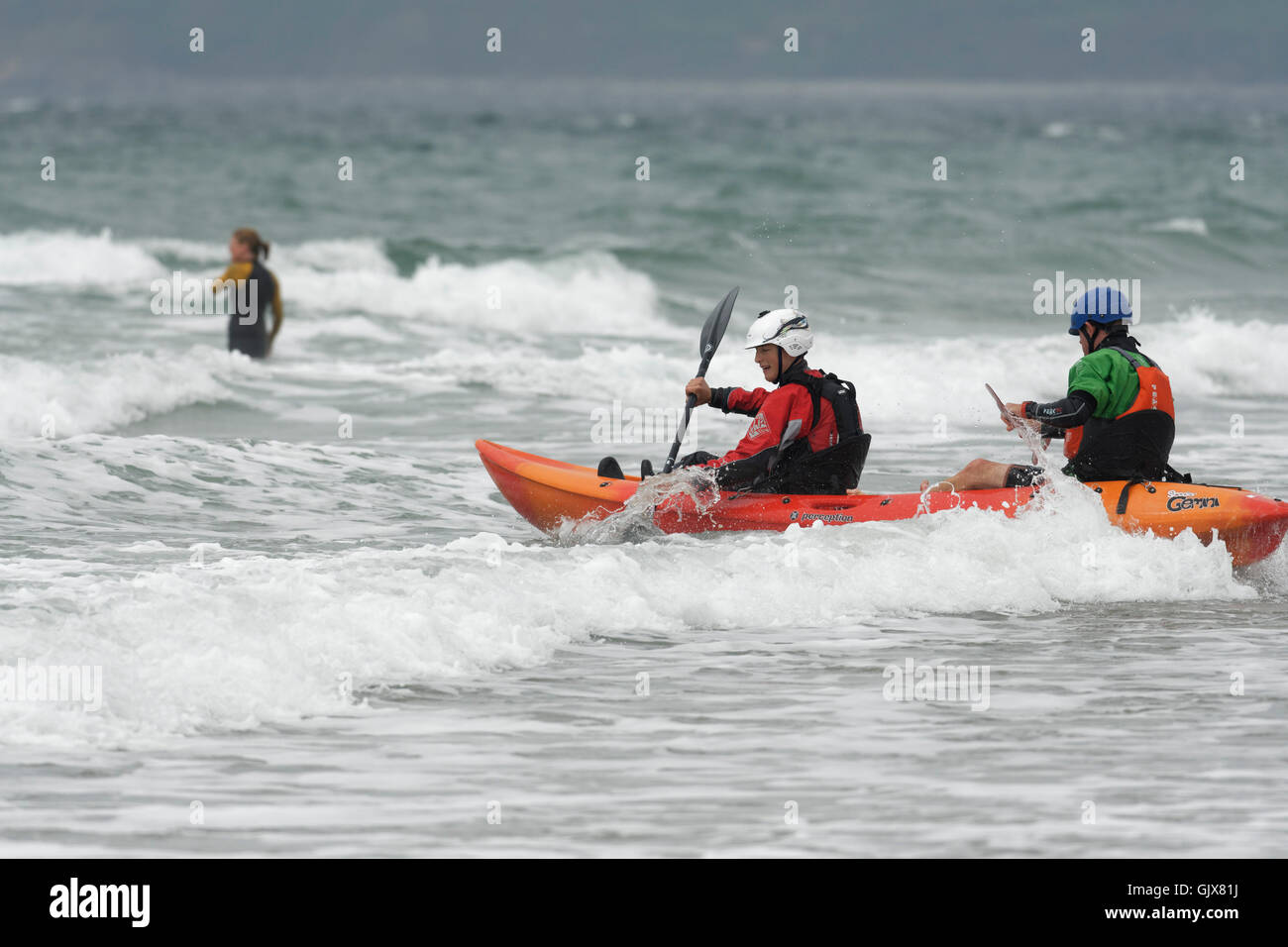 Kayaking on the beach in the surf at Porth Neigwl Stock Photo - Alamy
